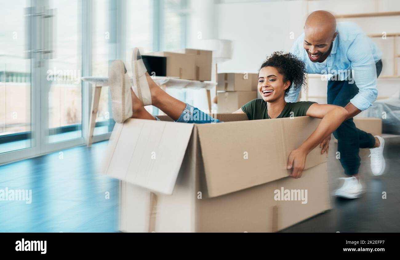 This is our new adventure. Shot of a young couple having fun while ...