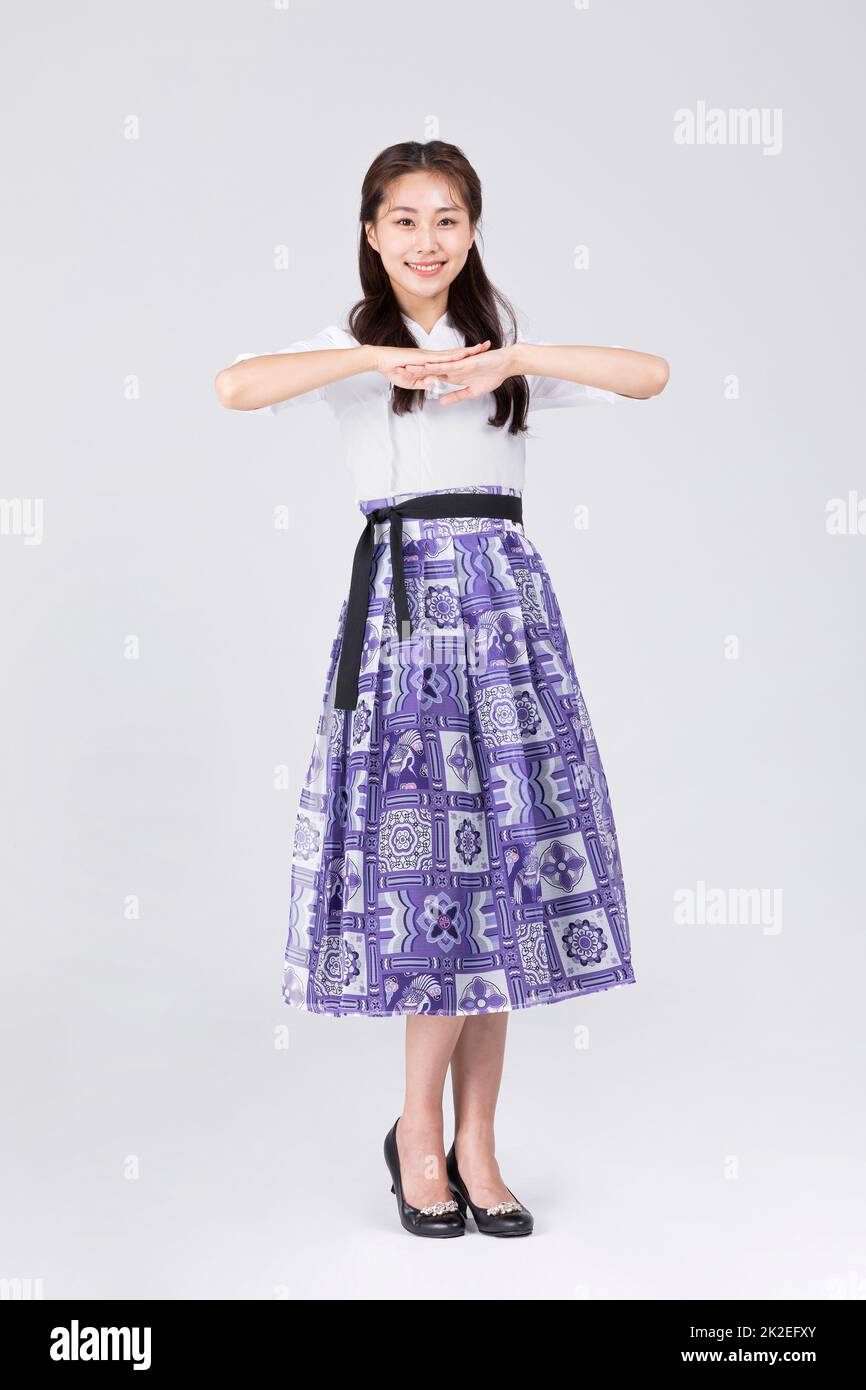 beautiful Korean woman in 20s wearing modern Hanbok bowing Stock Photo ...