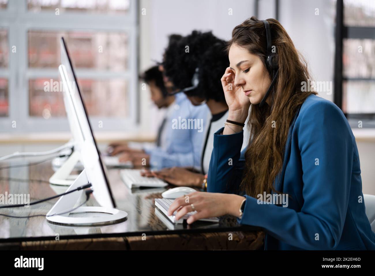 Young call center employee hi-res stock photography and images - Alamy