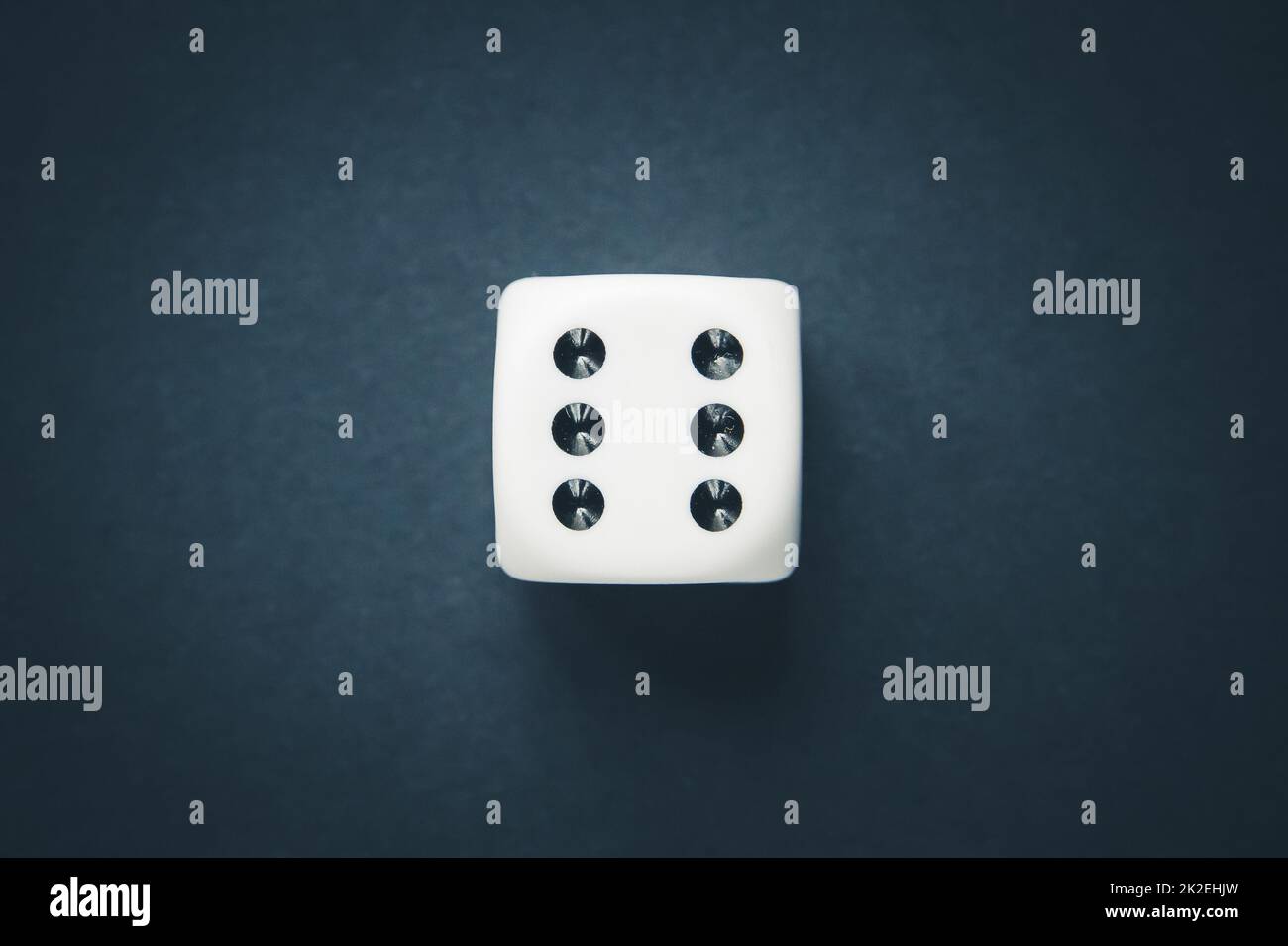 White dice on black table background Stock Photo - Alamy