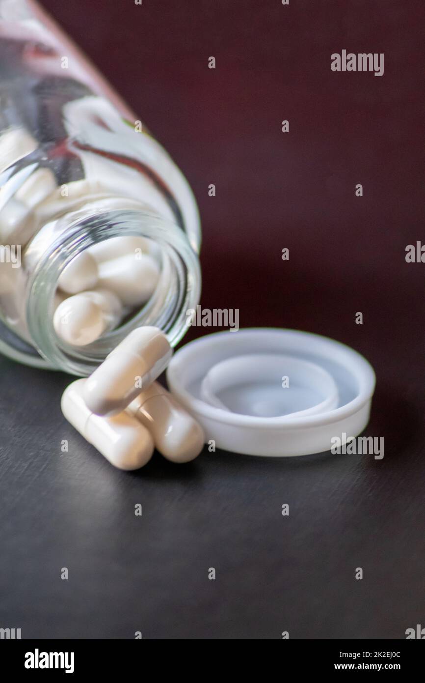 Many pills in medical jar for depression treatment show pandemic and ...