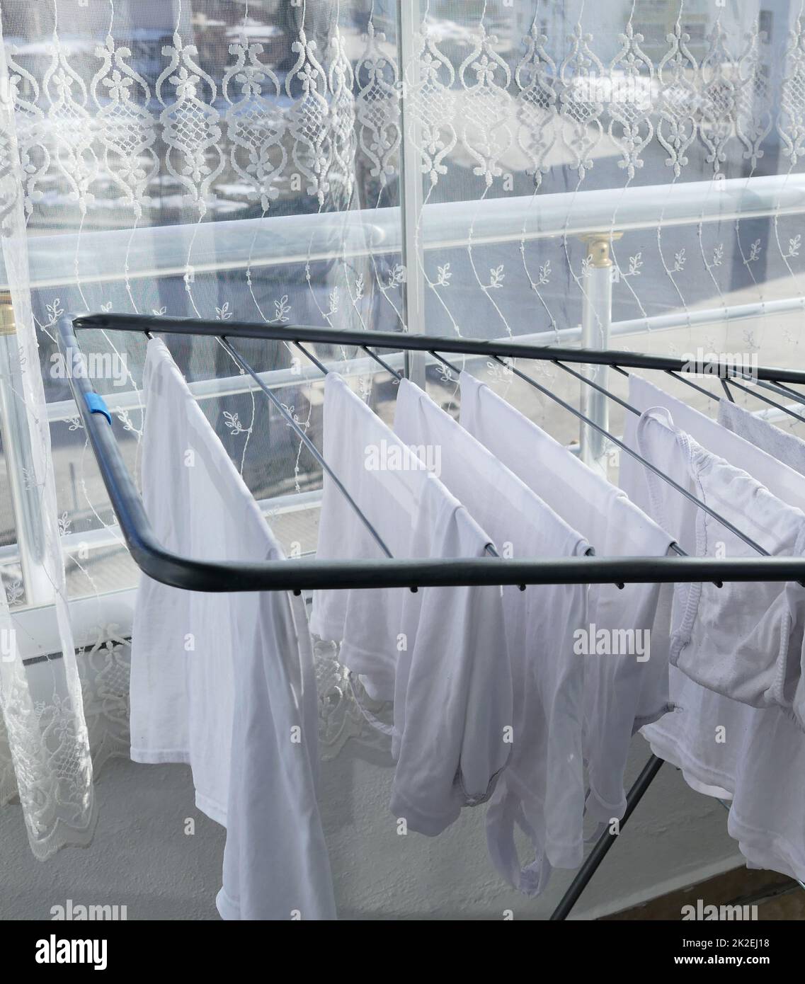 Drying clothes on the balcony in sunless and cold weather Stock Photo ...