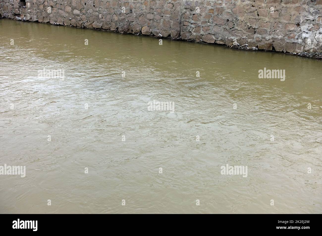 a river with murky waters, a river flowing through a settlement Stock ...