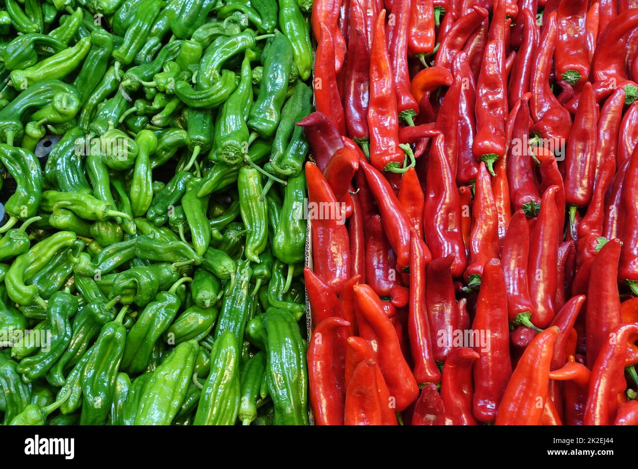 In the greengrocer aisle, red capia pepper and green pepper are on sale ...