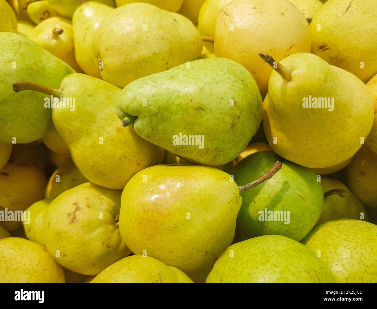 Food background yellow and green fresh ripe pears, close-up view from ...