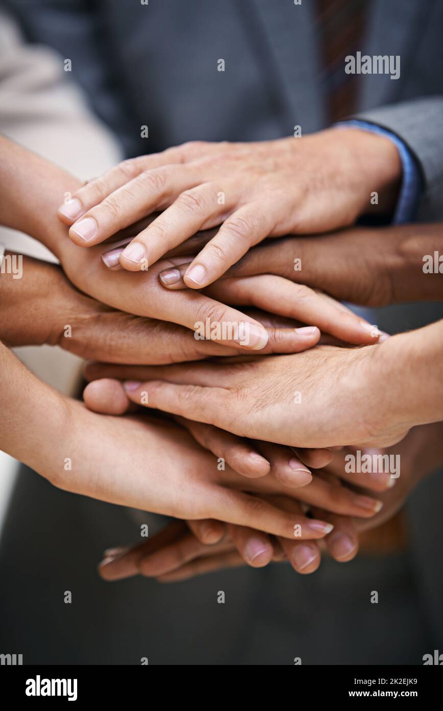 People putting hands together united hi-res stock photography and ...