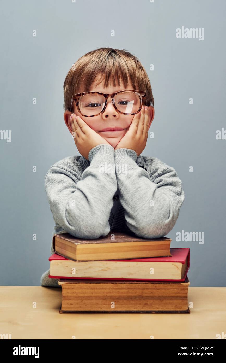 Child leaning over desk hi-res stock photography and images - Alamy