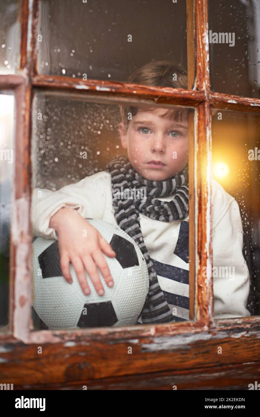 Boy looking bored and sad hi-res stock photography and images - Alamy