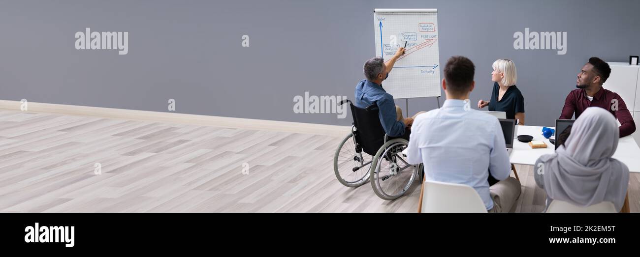 Disabled Mature Businessman Giving Presentation To His Colleagues Stock ...