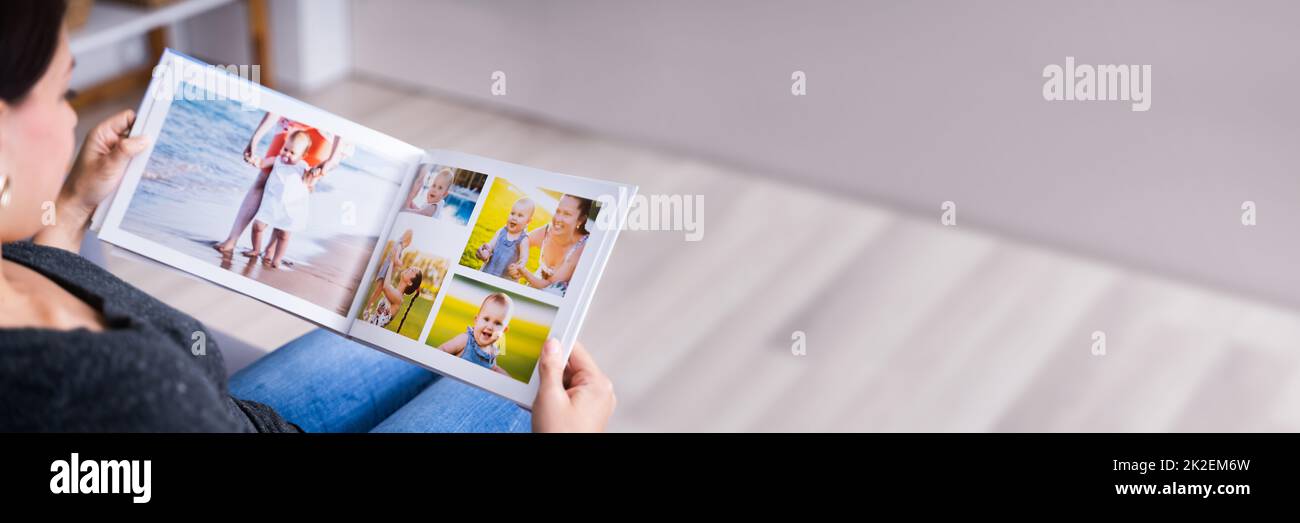 Woman looking photo album hi-res stock photography and images - Alamy