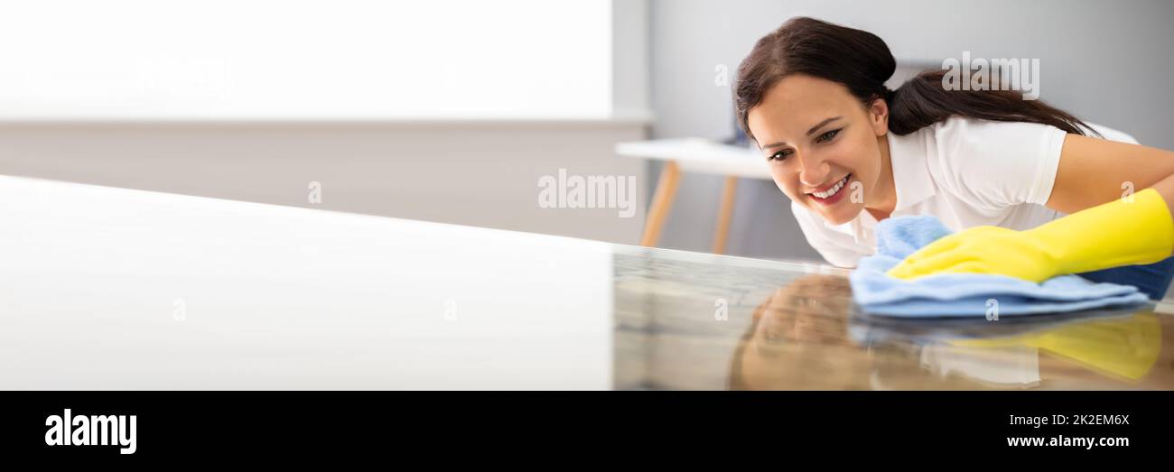 Female janitor cleaning table hi-res stock photography and images - Alamy