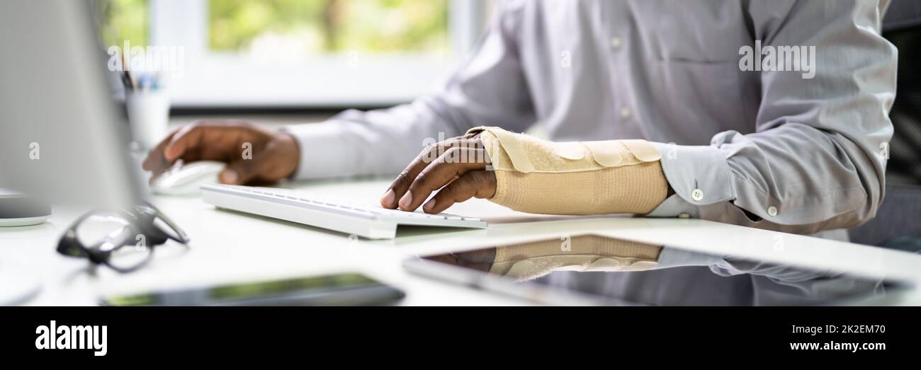 Broken Arm Office Accident. Worker Compensation Stock Photo - Alamy