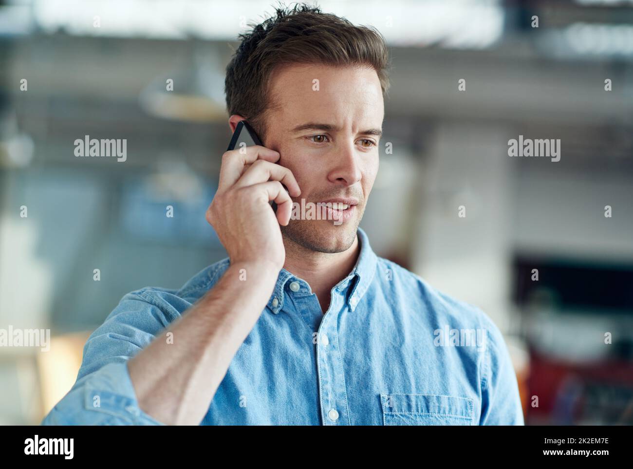 Hes a model employee. a casually-dressed businessman standing in his ...