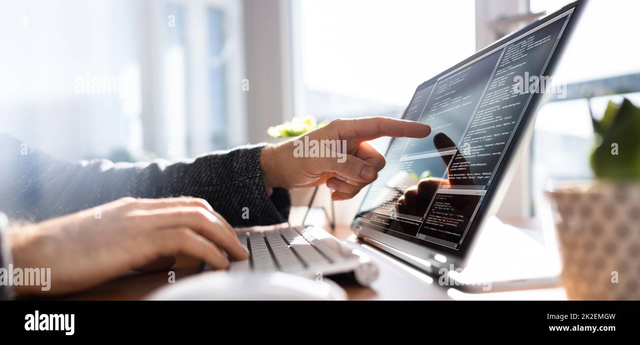 Programmer Or Coder At Office Desk Stock Photo - Alamy