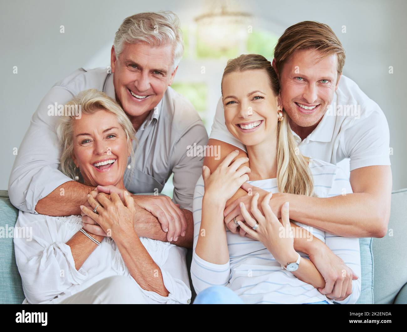 Smile, hug and portrait of happy family relax on living room sofa ...