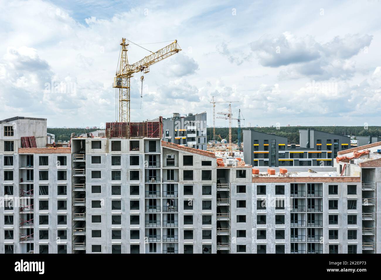 aerial view of city construction site with apartment building and ...