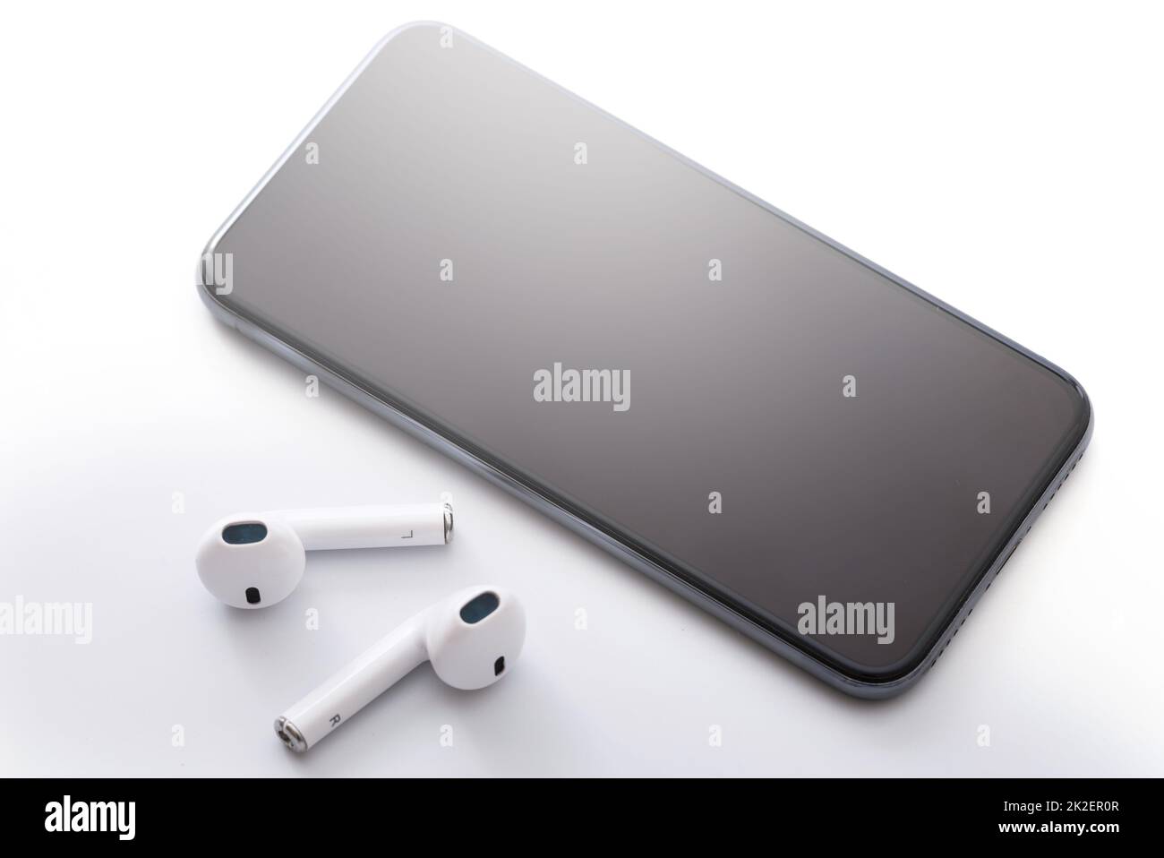 White wireless bluetooth earphones hi-res stock photography and images ...