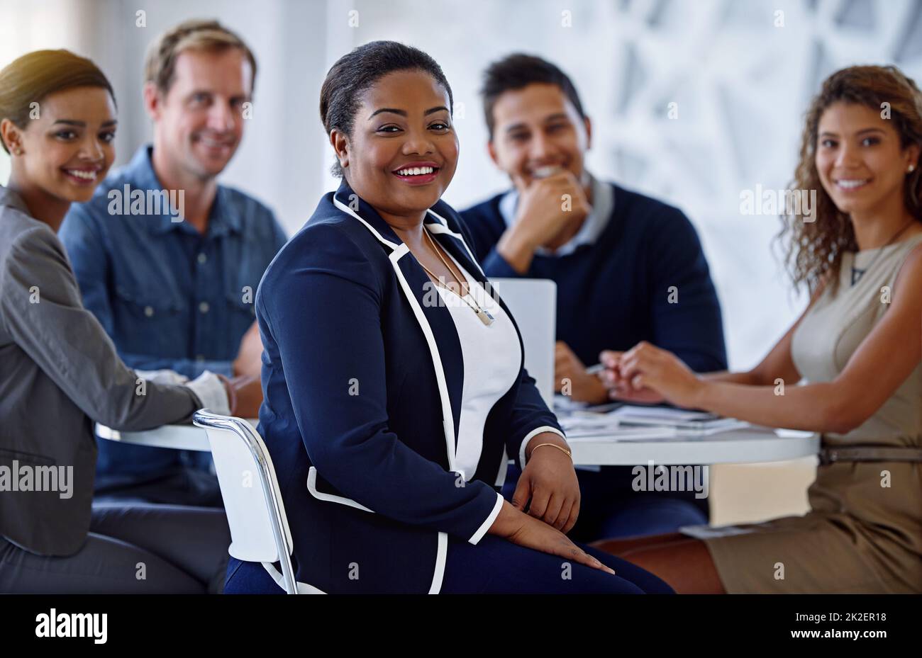 Yes, Were the best. Portrait of a group of smiling colleagues sitting ...