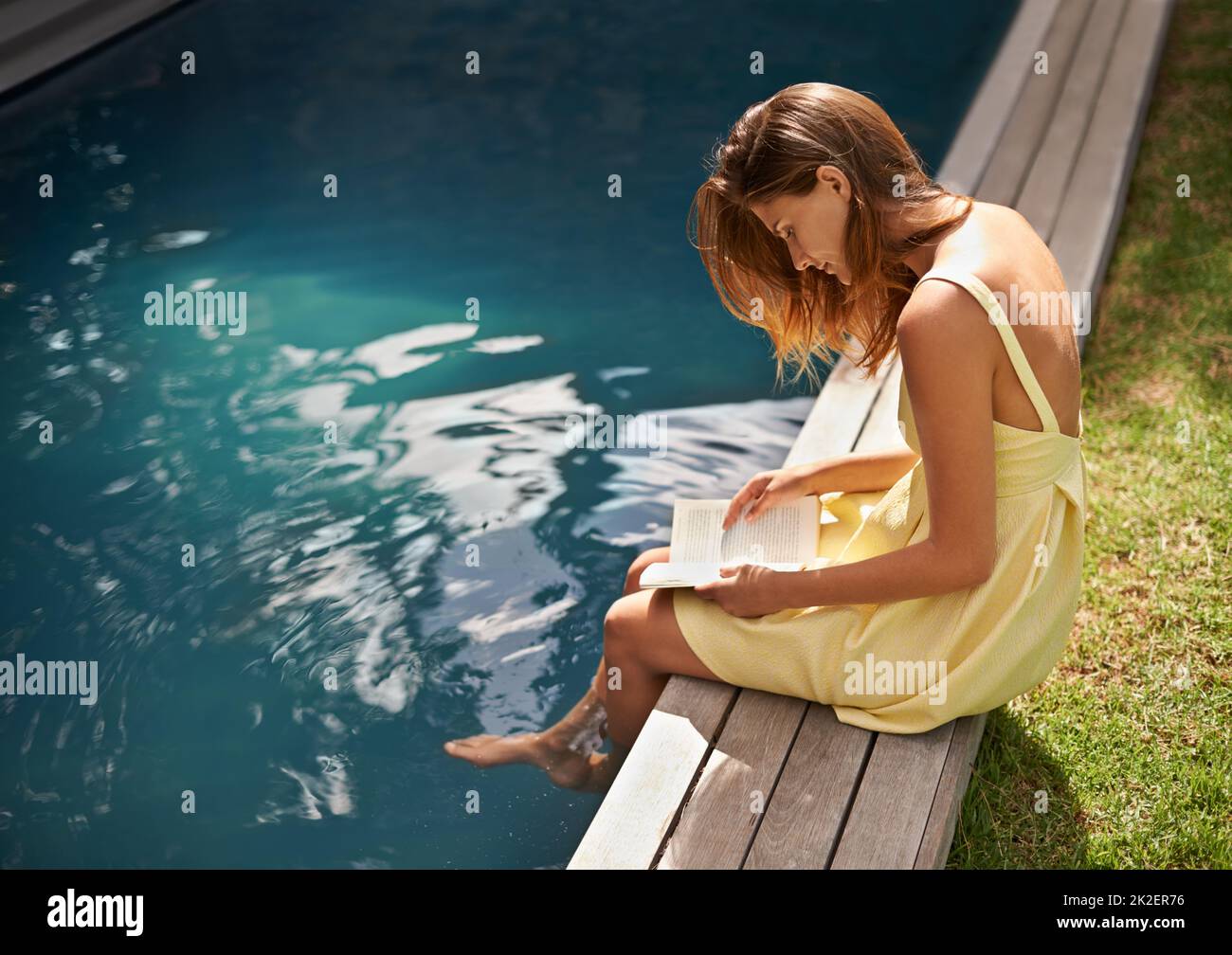 Reading outside pool hi-res stock photography and images - Alamy