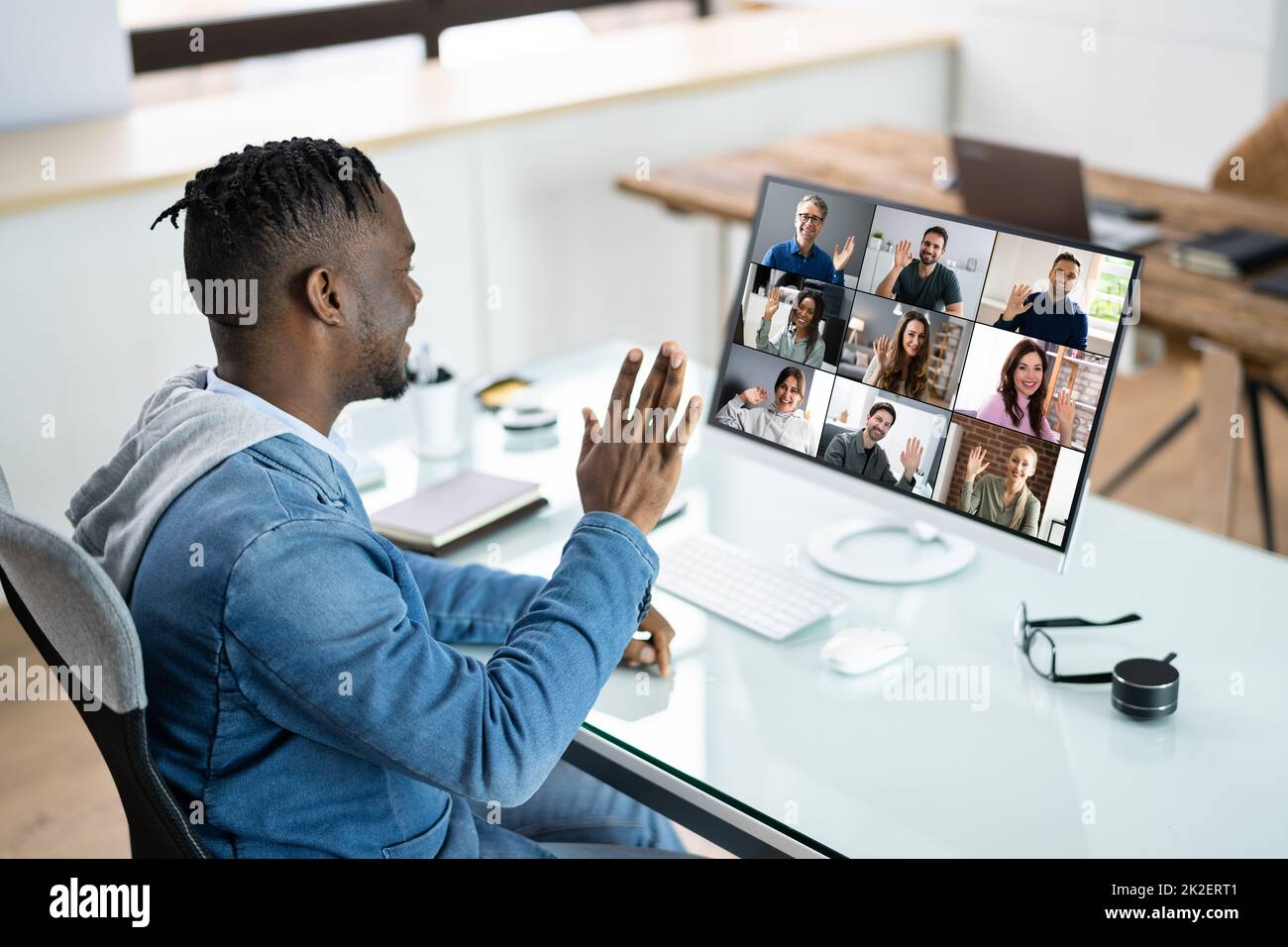 Virtual Video Conference Interview In Office Waving Hand Stock Photo ...