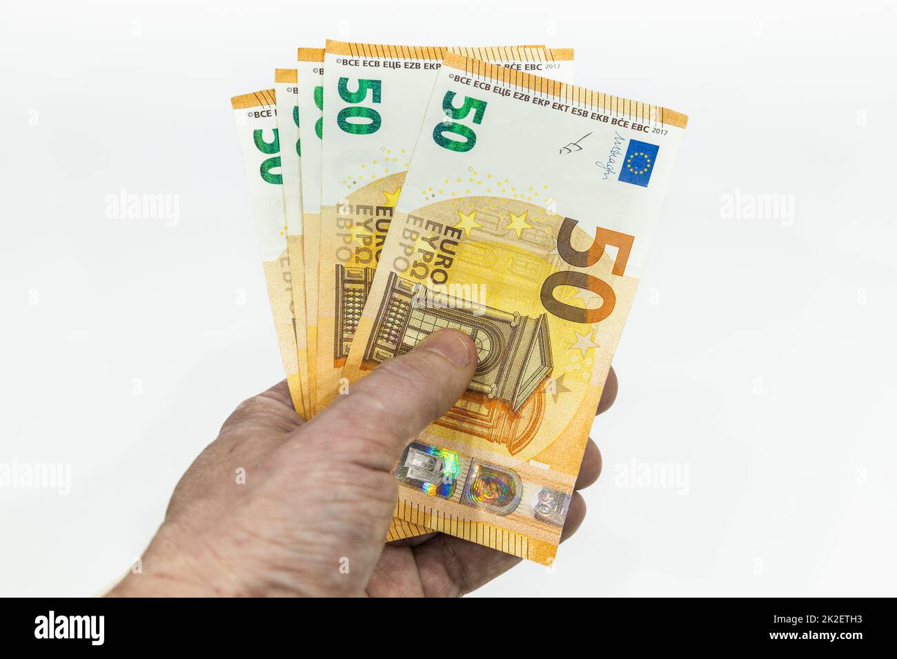 Hand holding 50 euro note hi-res stock photography and images - Alamy