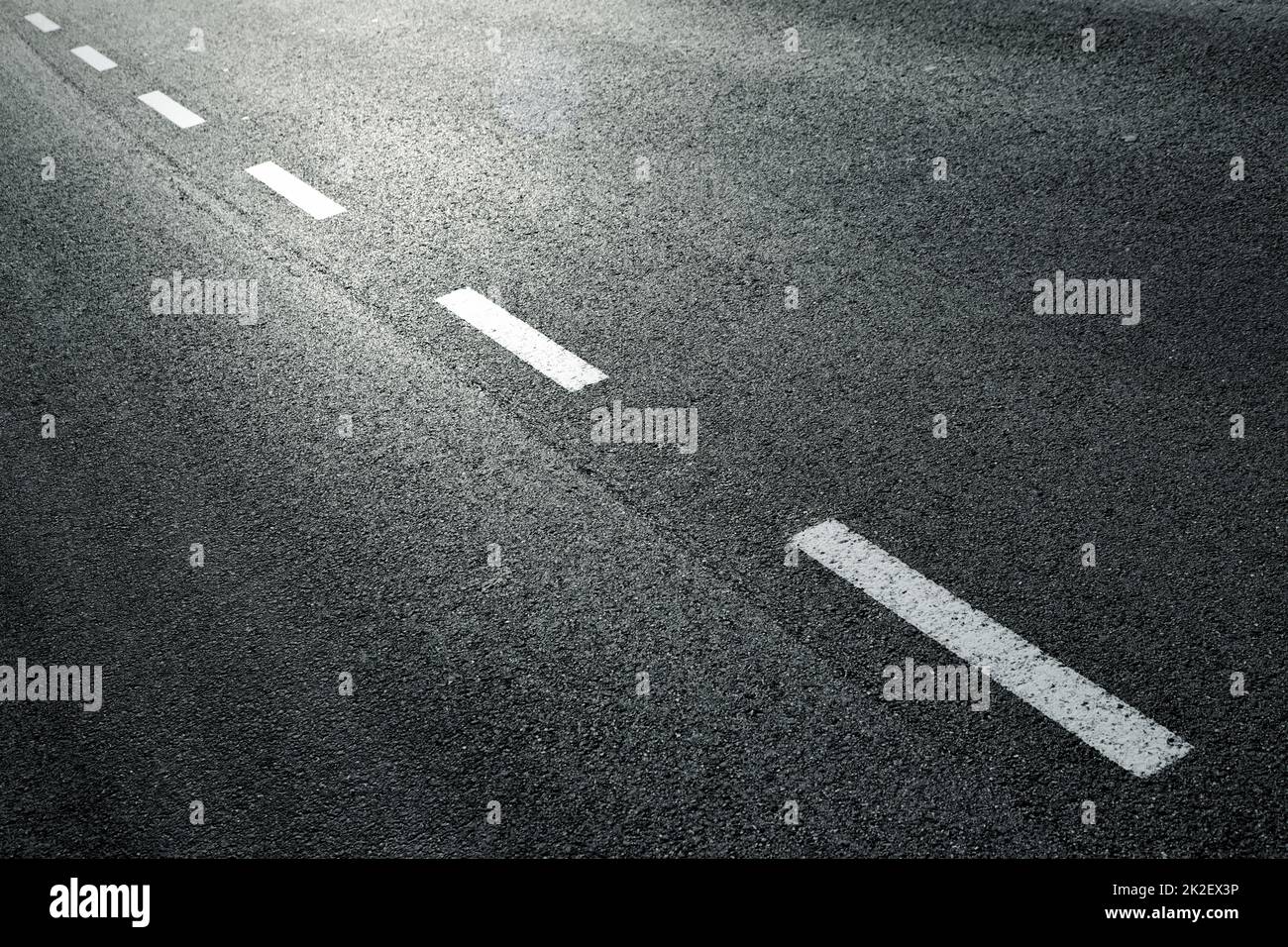 Dotted line on city asphalt road Stock Photo - Alamy