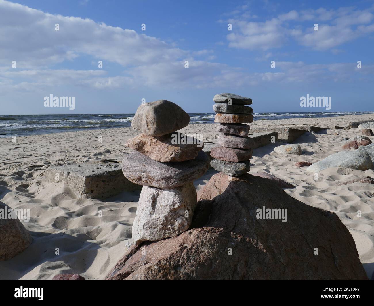 Beach landscape with stone pyramids Stock Photo - Alamy