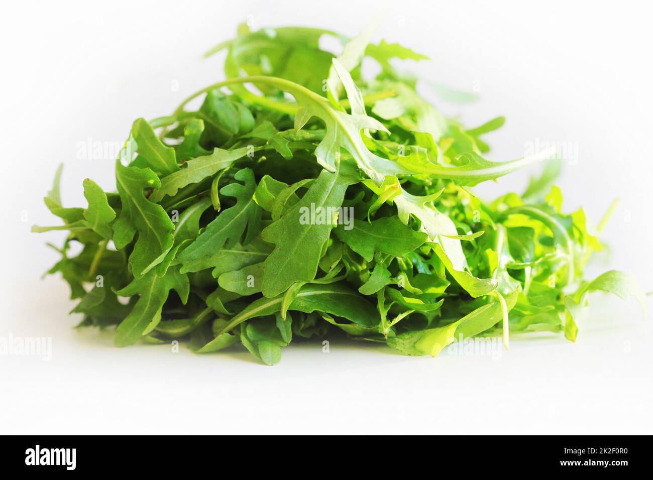 Fresh arugula leaves rucola on white background Stock Photo - Alamy