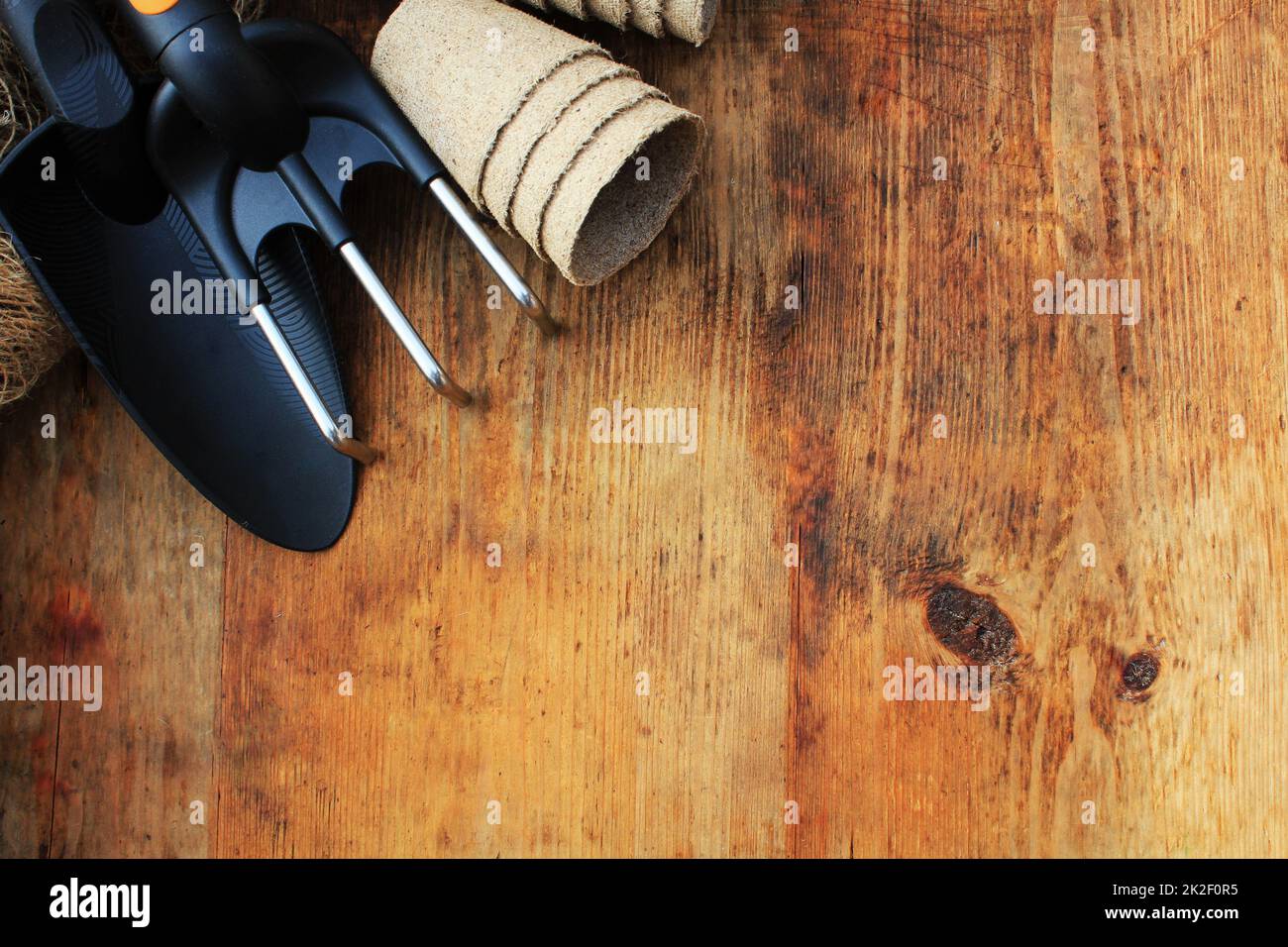 Gardening concept background with garden tools and pots on wooden ...