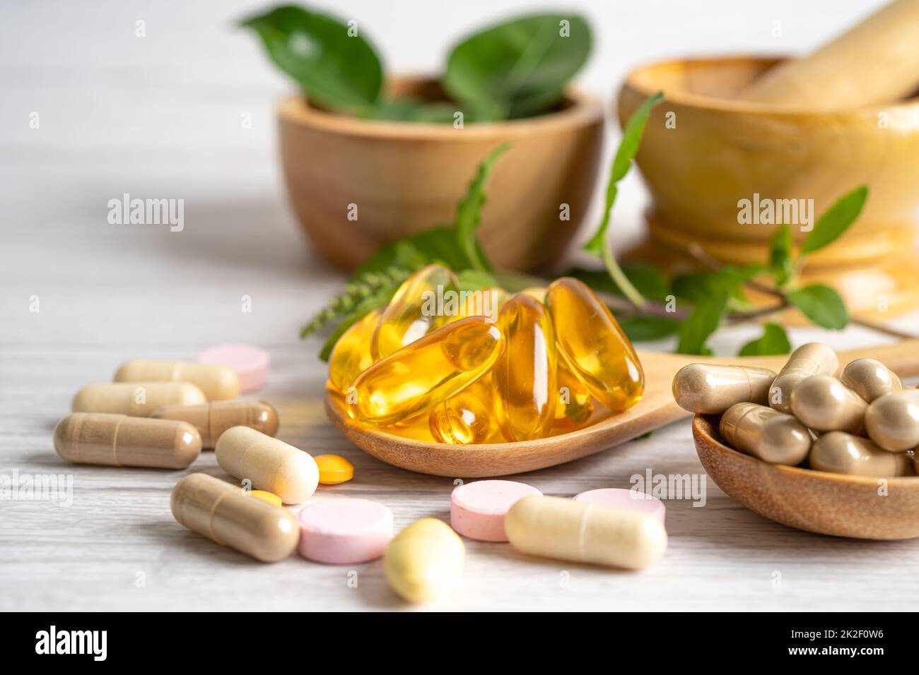 Alternative medicine herbal organic capsule drug with herbs leaf ...