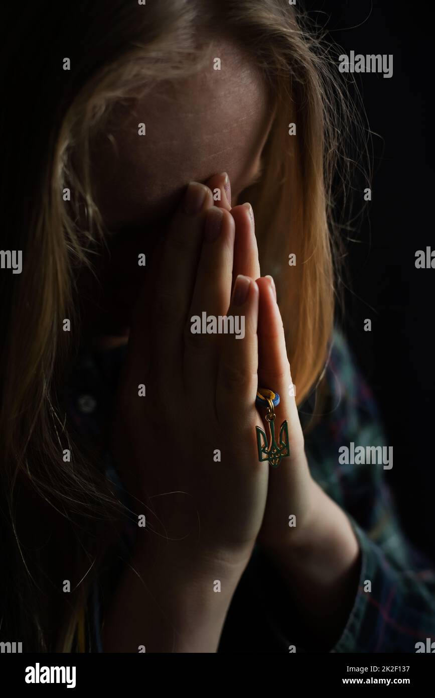 Woman praying, God save Ukraine Stock Photo - Alamy
