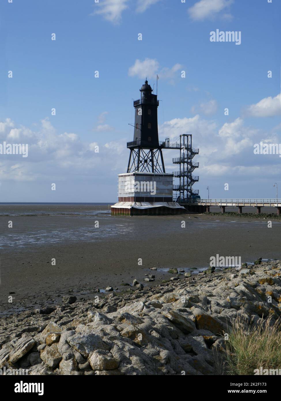 Lighthouse in the mud flats, Dorum Neufeld Stock Photo - Alamy