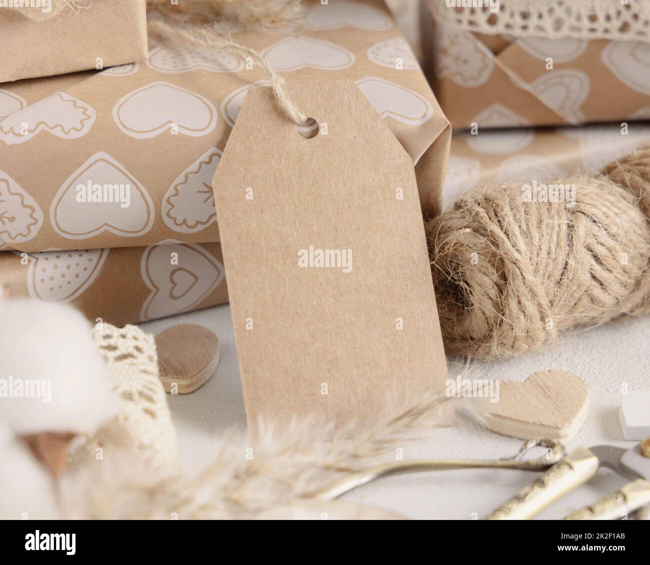 Valentines present with vertical blank gift tag close up, Rustic Mockup ...