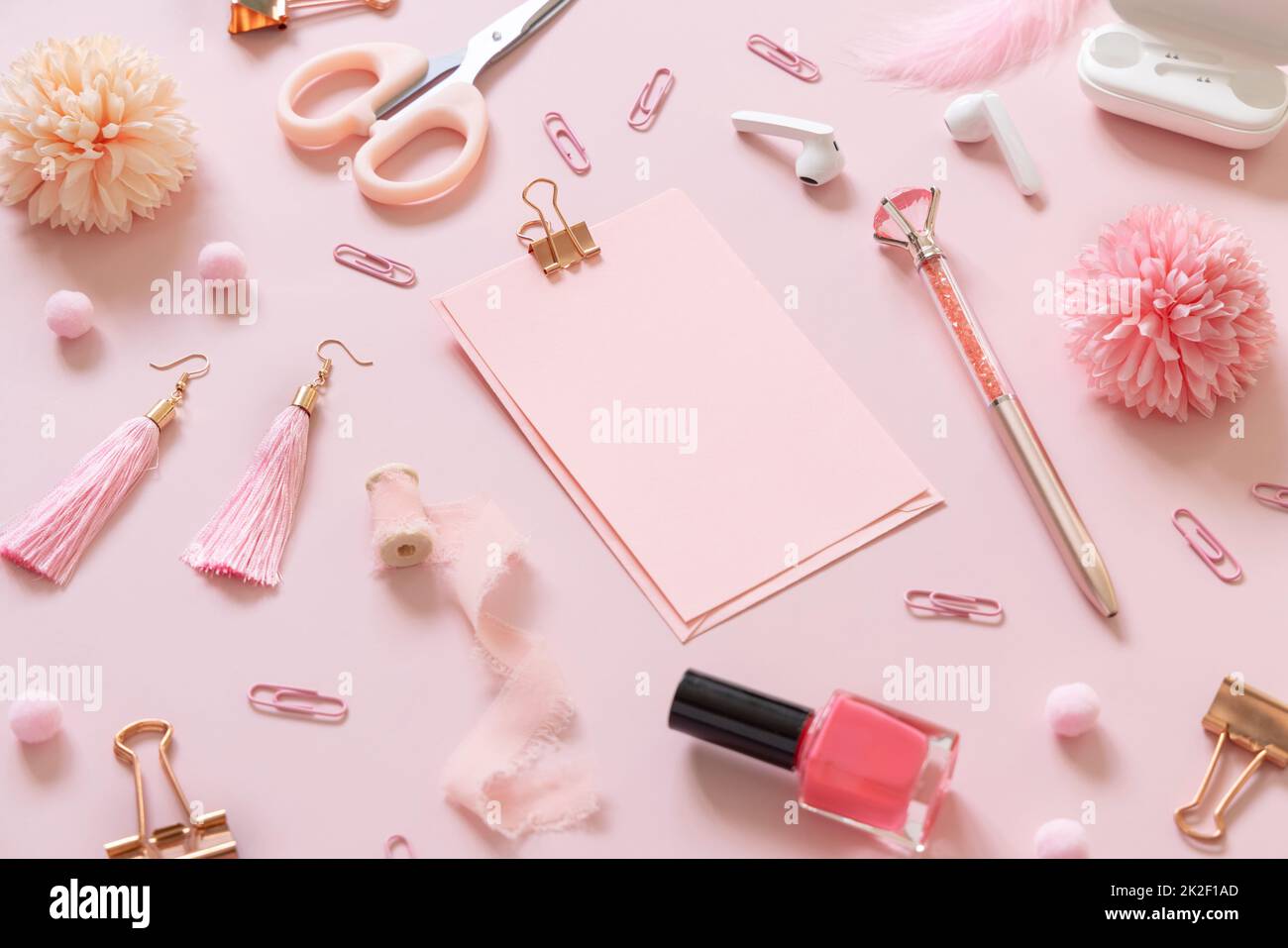 Paper with a clip and Pink school girly accessories on pastel pink ...