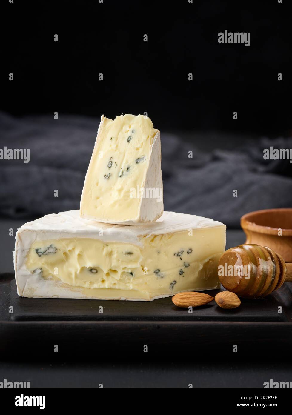 bergader blue cheese on a black wooden board, delicious snack Stock ...