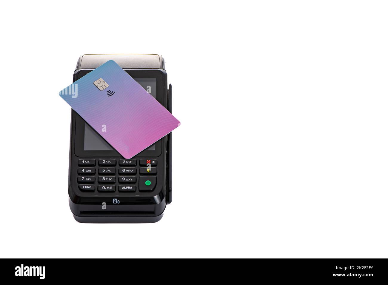 the plastic card lies on the payment terminal with a white isolated ...