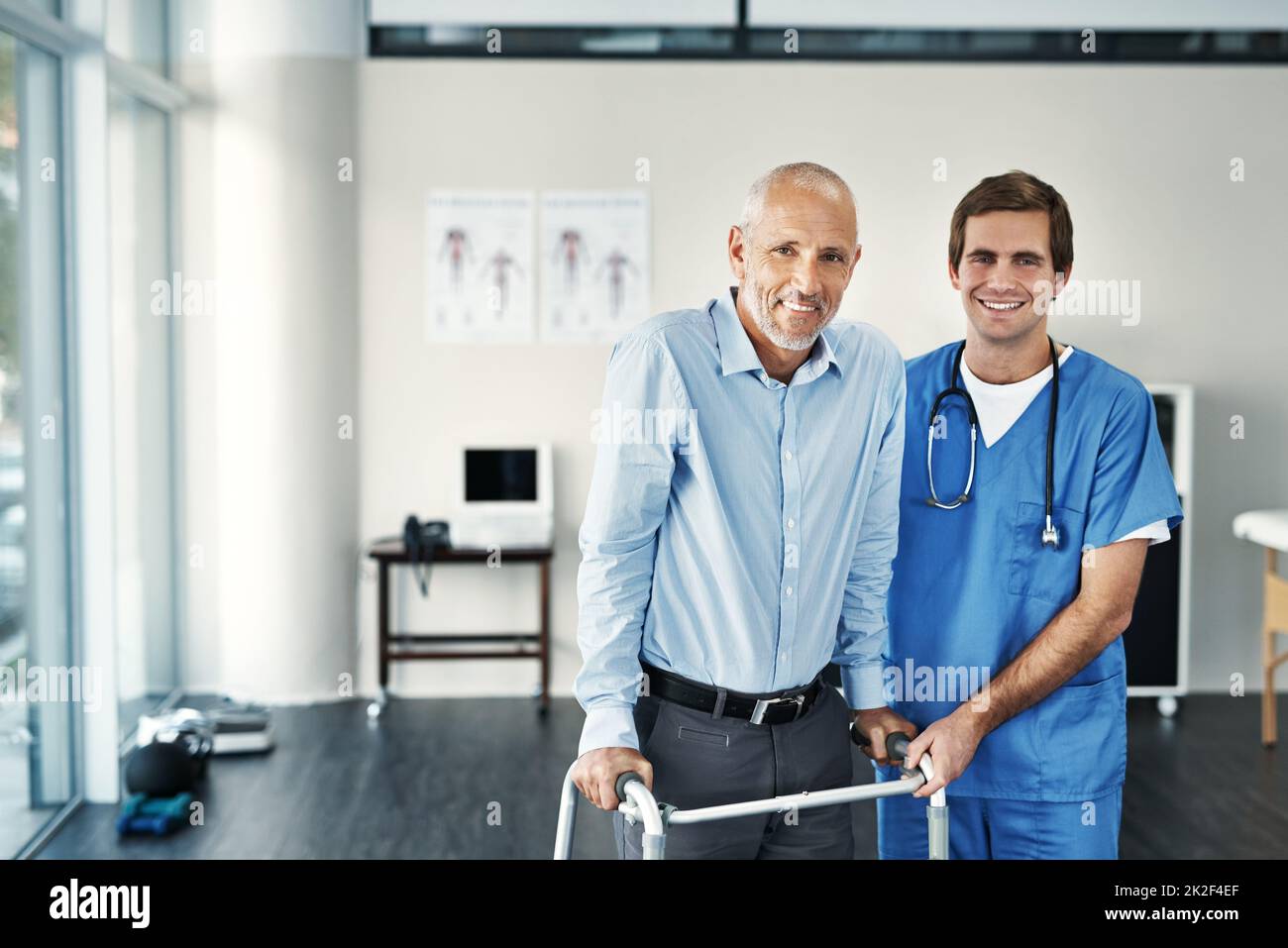 Nurse helping patient to walk hospital hi-res stock photography and ...