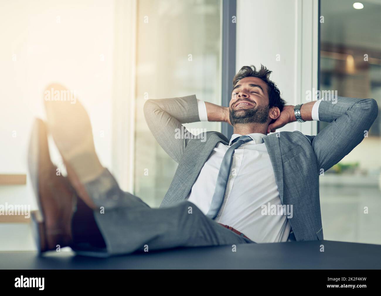Businessman sitting relaxing on chair hi-res stock photography and ...