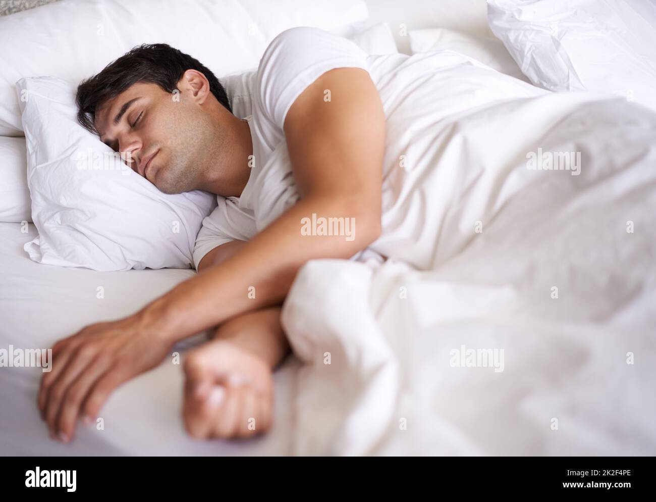 Is there anything better than a lie in. a young man sleeping in bed ... Is there anything better than a lie in. a young man sleeping in bed ...