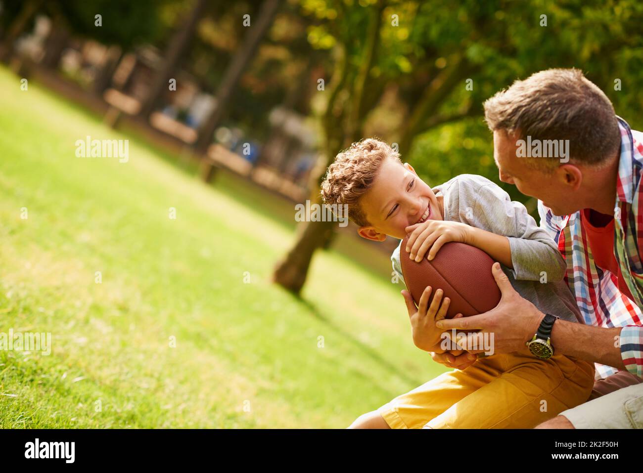 Father and son playing football hi-res stock photography and images - Alamy