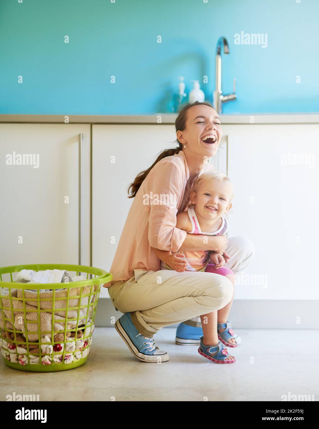 Moms doing housework with kids hi-res stock photography and images - Alamy