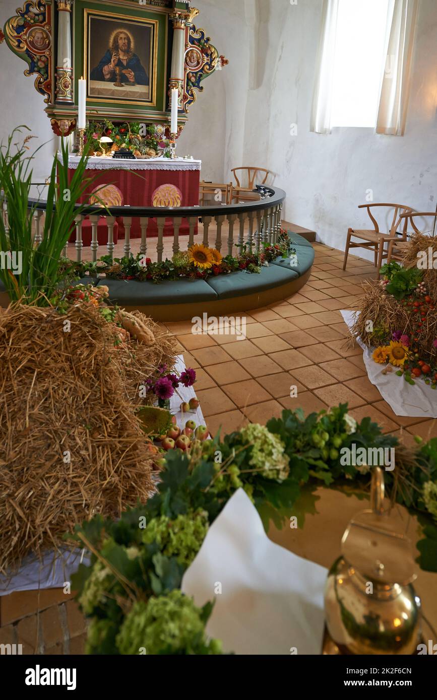 Offerings for the harvest festival. Offerings decorating an altar in a ...