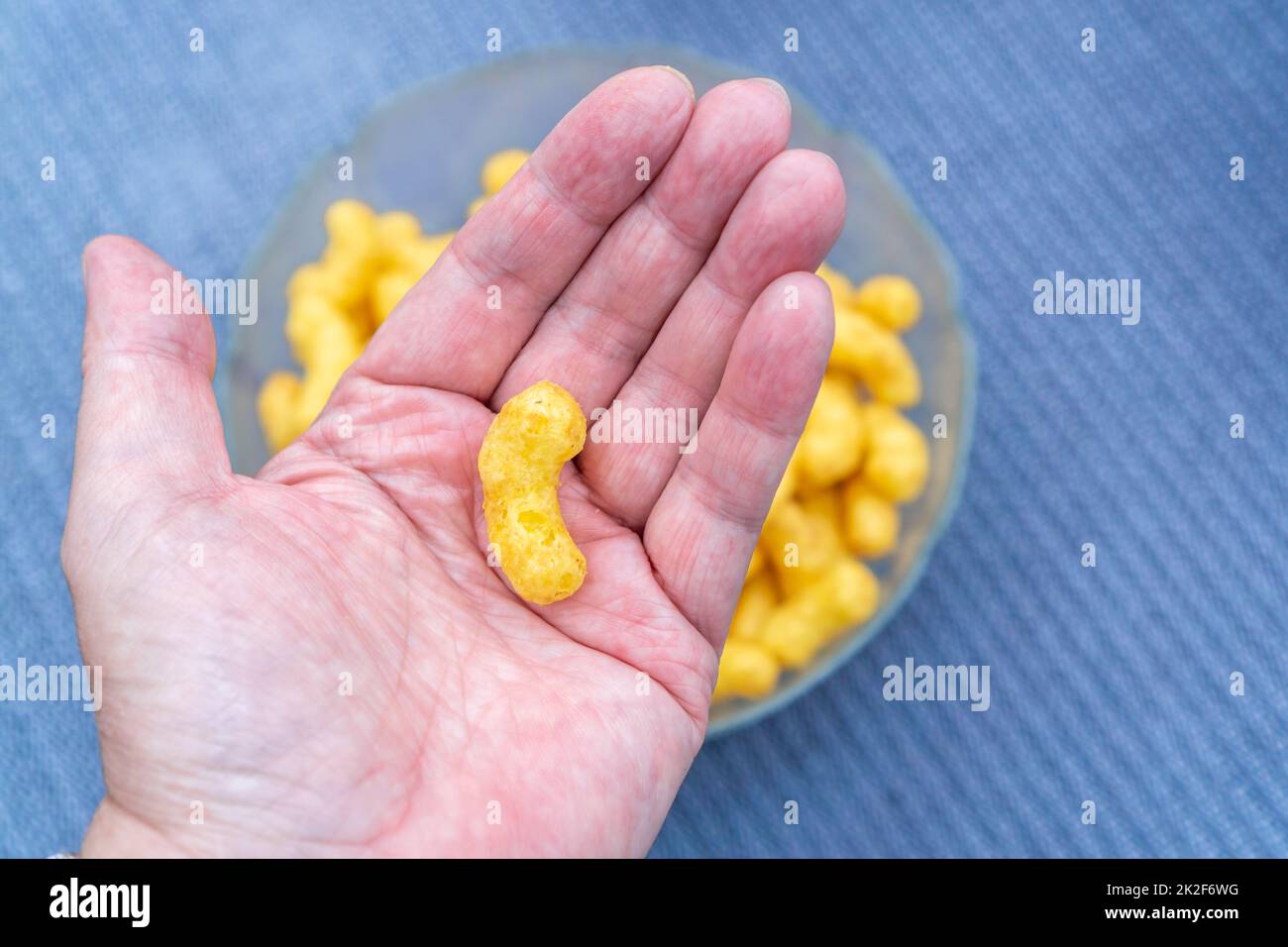 Hand with peanut flip Stock Photo - Alamy