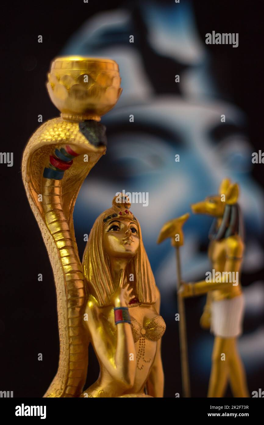 Egyptian statuettes anubis cleopatra and snake Stock Photo - Alamy