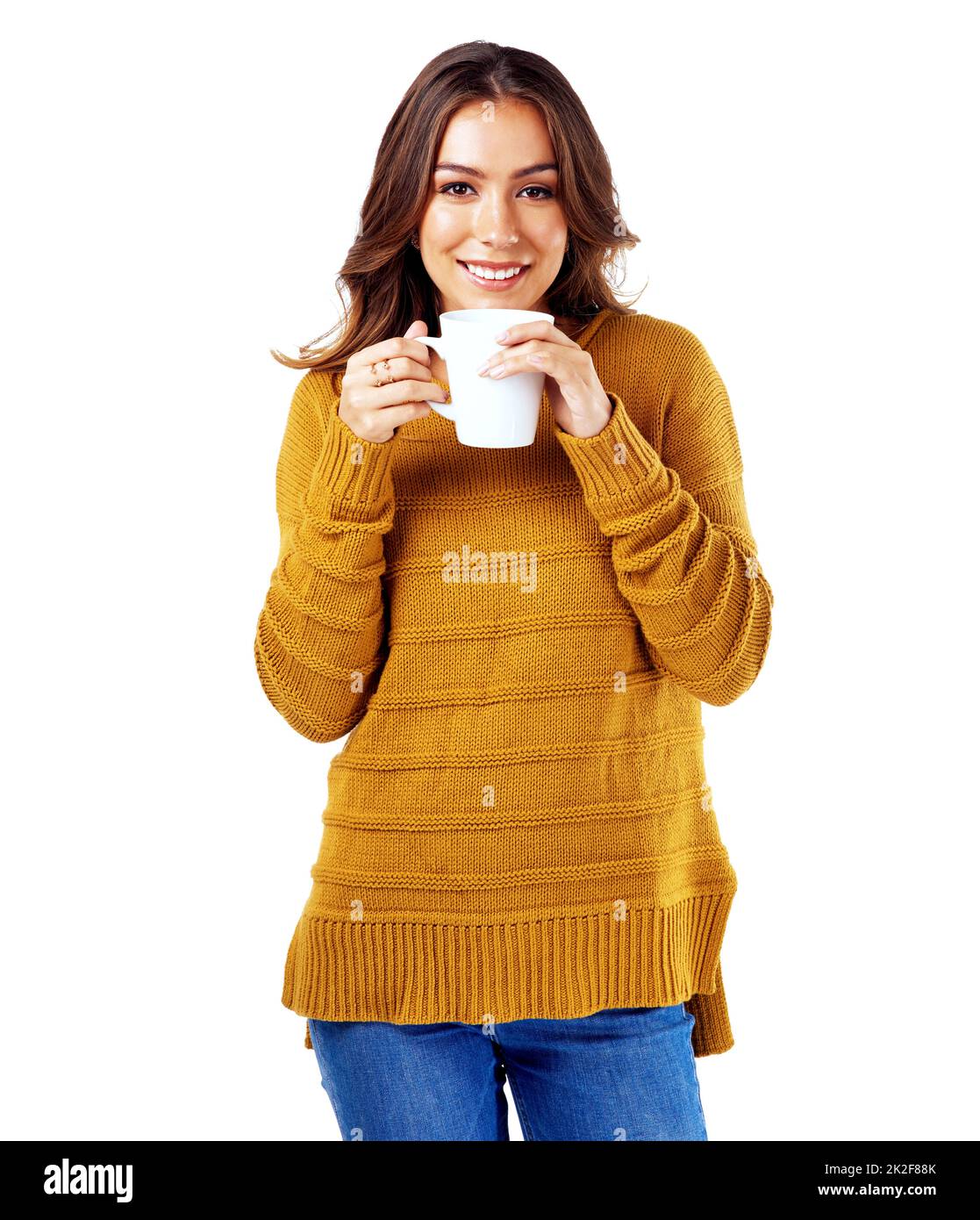 You cant say coffee without a smile. Studio shot of a woman drinking ...