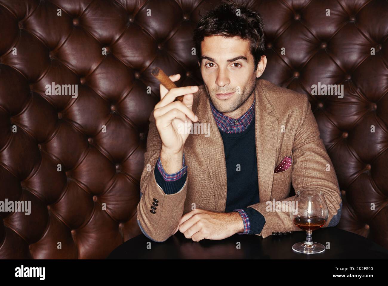 Handsome guy smoking cigar bar hi-res stock photography and images - Alamy
