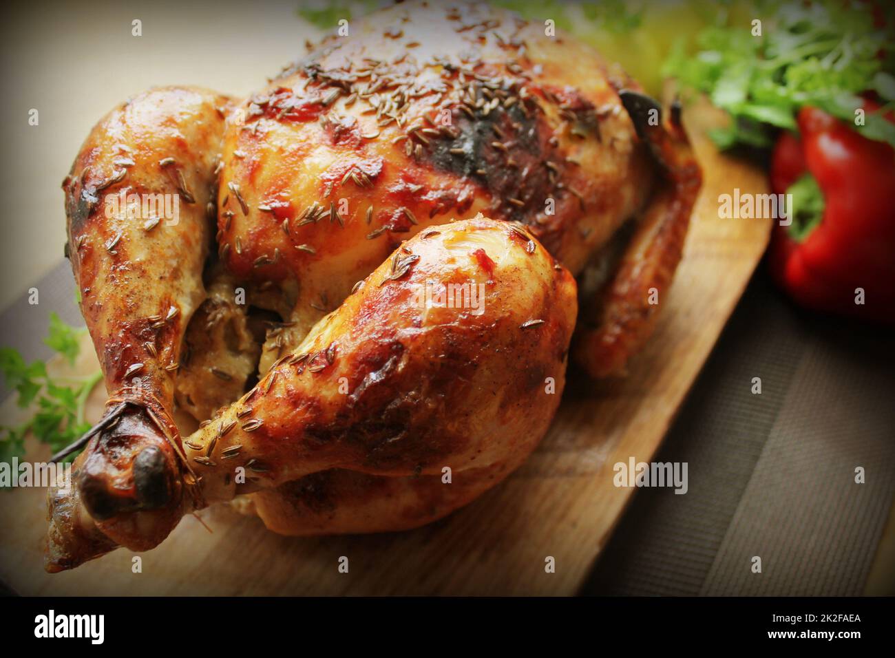 Whole roasted chicken on cutting board. Top view Stock Photo - Alamy