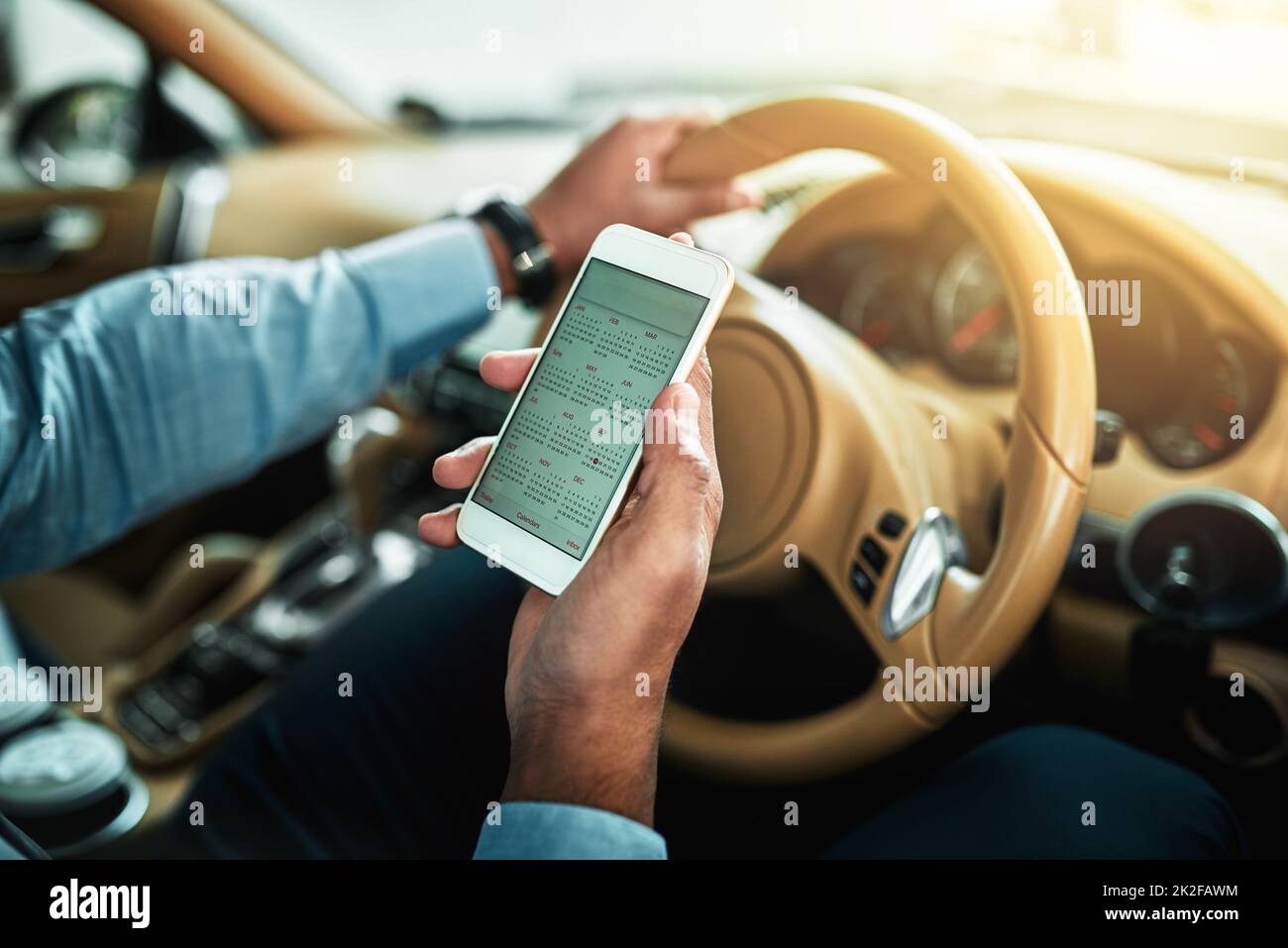 Doing a quick check in with his schedule. Closeup shot of an ...