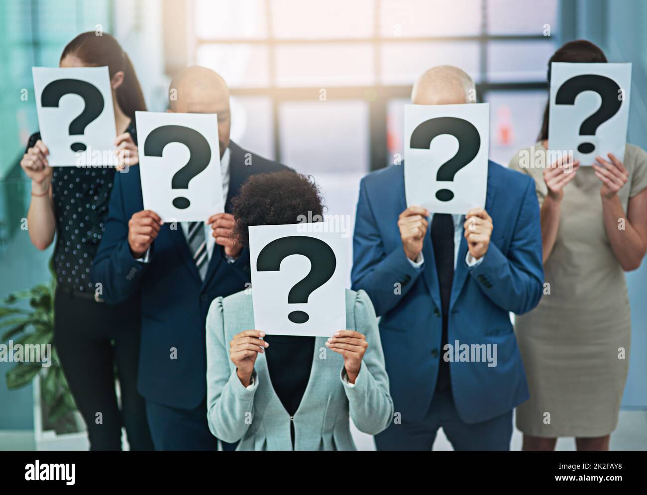 Business team holding question marks hi-res stock photography and ...