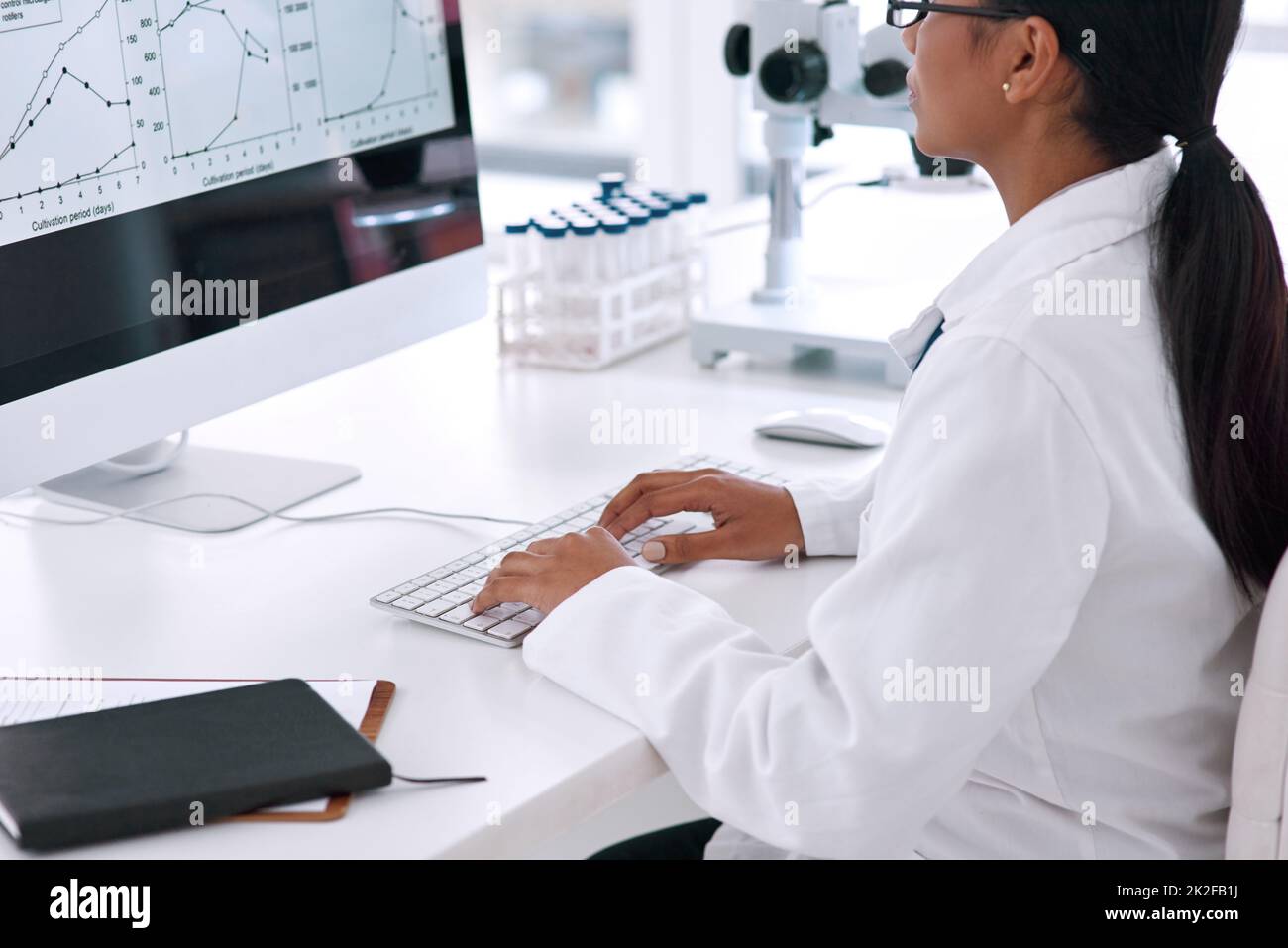 Shes a genius behind the computer. Cropped shot of an unrecognizable ...